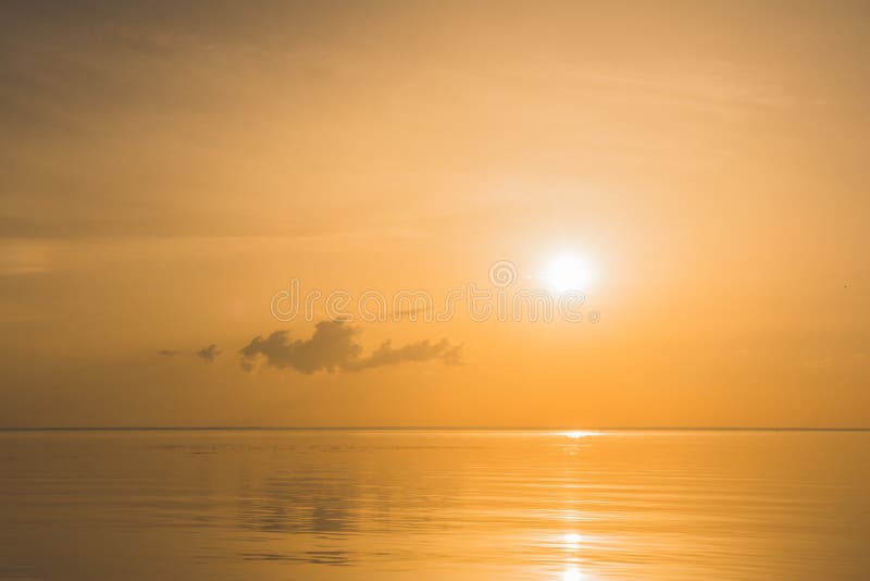 Dimmed Soft Sunset on the Ocean with Small Clouds Stock Photo - Image ...