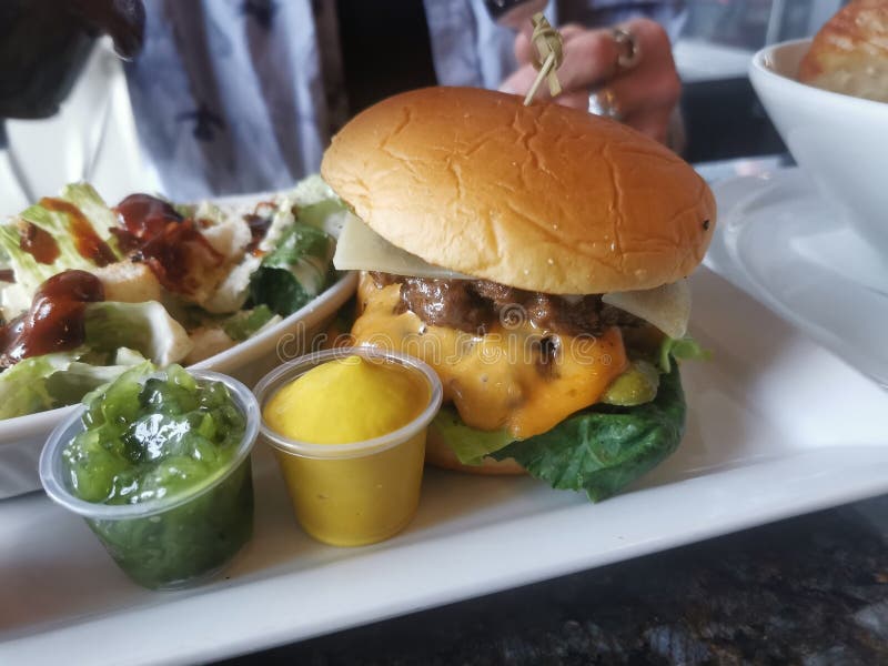 Diner Cheeseburger with Mustard and Relish Stock Photo - Image of dish ...