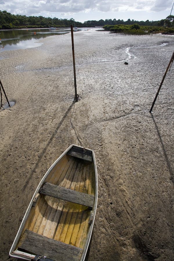 Dingy at low tide stock image. Image of idyllic, hull - 33163565