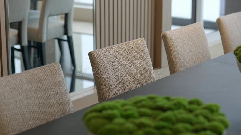 Dining Area with Beige Textile Chairs Standing in Row by Long Dark ...