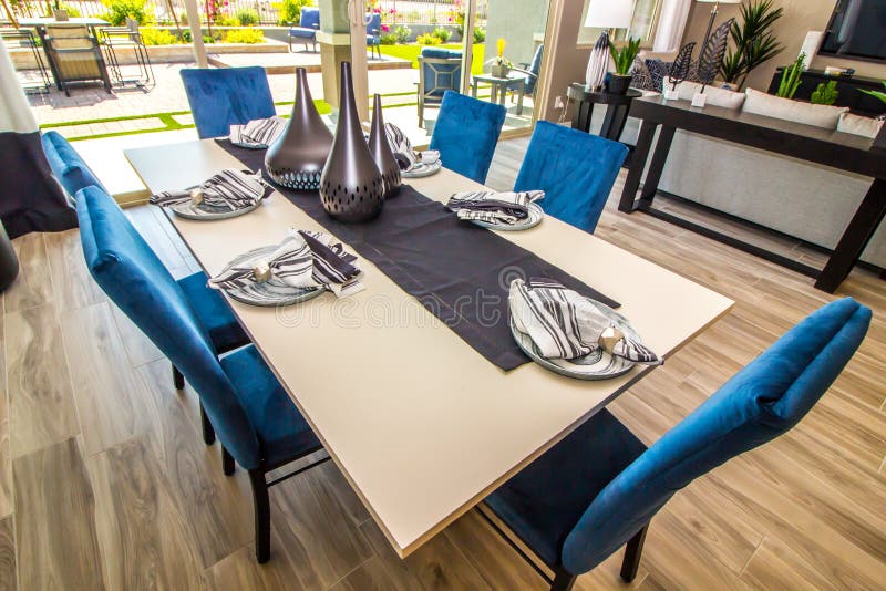 Dining Area with Rectangular Table & Six High Back Blue Chairs Stock ...