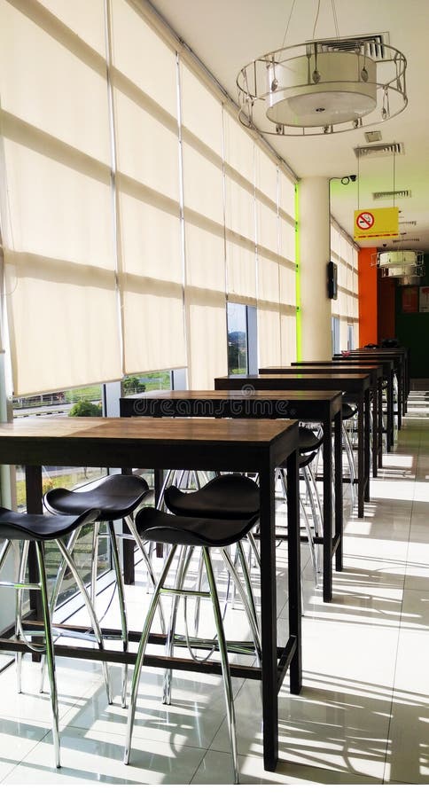 Dining area beside window stock photo. Image of decorated - 56352894