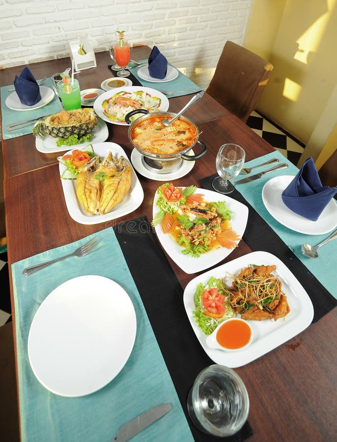 Dining Food on table stock photo. Image of hands, food - 103069300