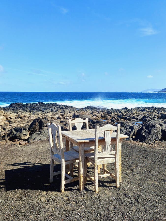 Square Table and Wooden Chairs Outdoors by the Sea. Dining, Leisure ...