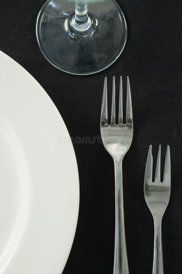Dining Plates Set on Black Theme Table Stock Image - Image of reserved ...
