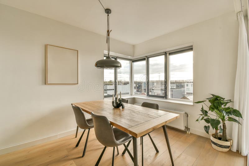 A Dining Room with a Large Window and a Table Stock Image - Image of ...