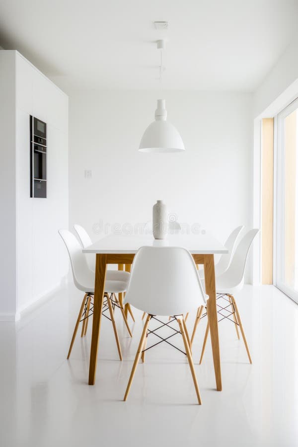 Dining Room with White Table and White Chairs and White Light Fixture ...