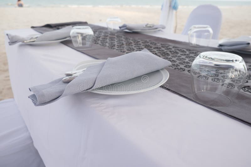 Dining table on the beach stock image. Image of food - 114144395