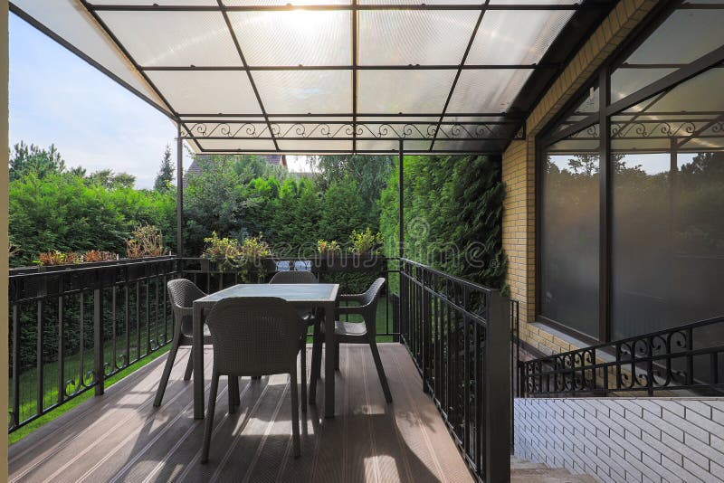 Dining Table with Chairs on the Terrace of the House Stock Photo ...