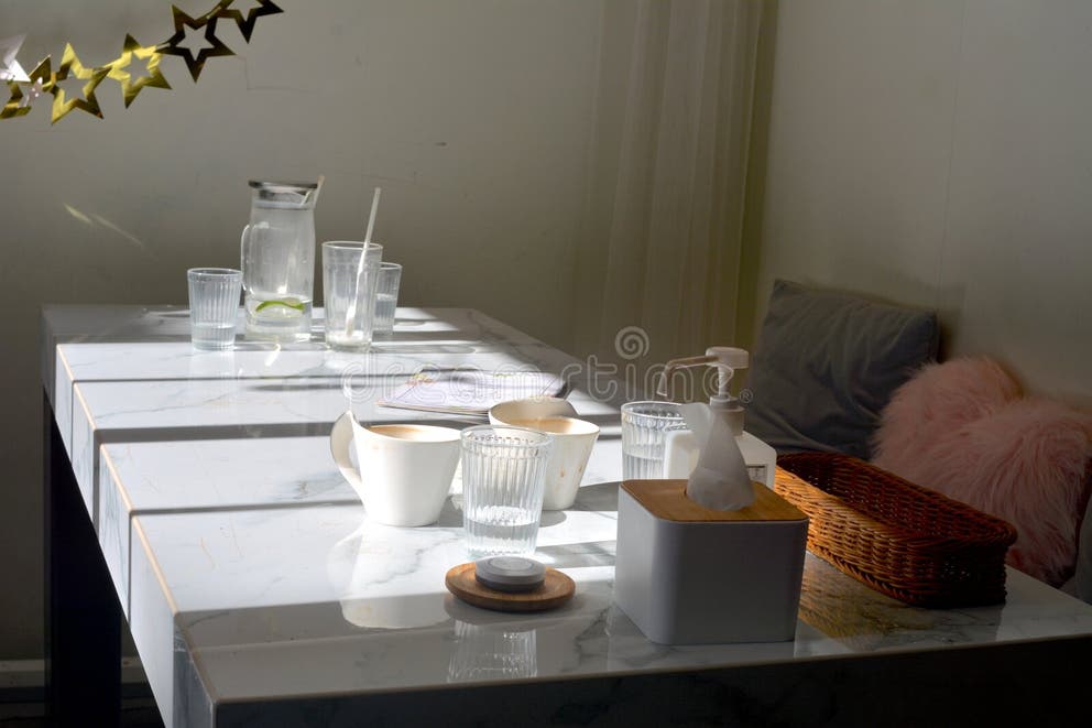 Cutlery, Cups and Plates on the Dining Table Under Light and Shadow ...