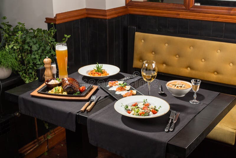 Dining Table Food Set with Appetizer and Drinks in Restaurant Stock ...