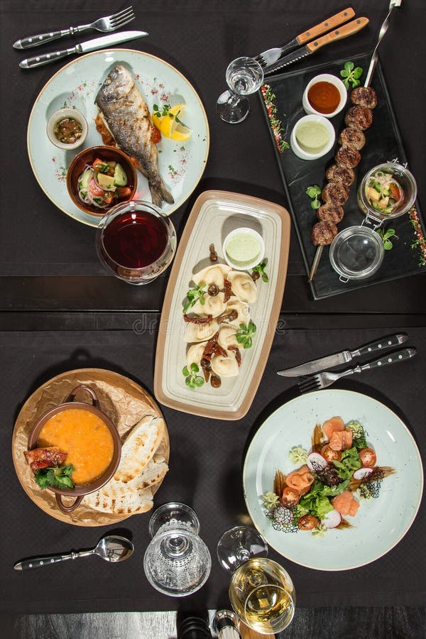 Dining Table Food Set with Appetizer and Drinks in Restaurant Stock ...