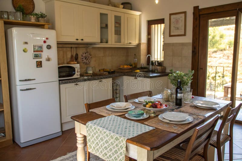 Dining Table in Kitchen with Fridge and Counter Stock Image - Image of ...