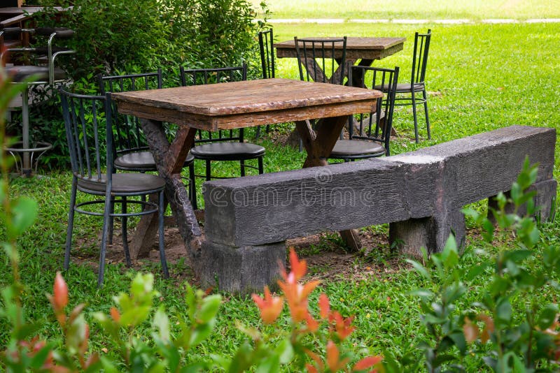 Dining Table Outdoor Under Big Tree in the Park with Blur Plant ...