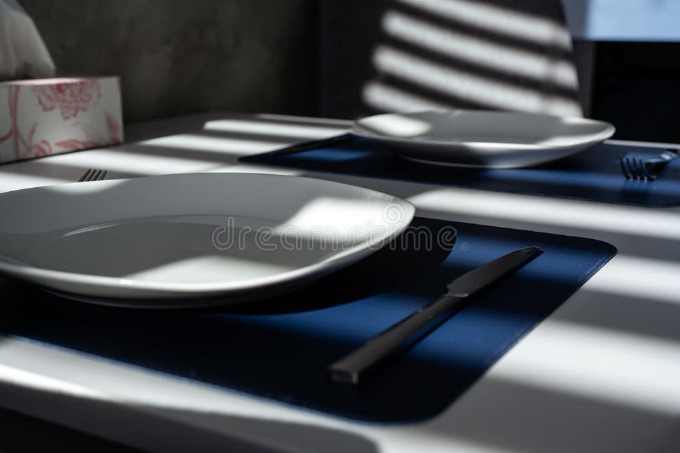 Dining Table with Plates and Tissue Box Stock Image - Image of sunlight ...