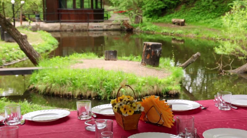Dining Table is Set in Bower Ashore of Small Pond Stock Video - Video ...