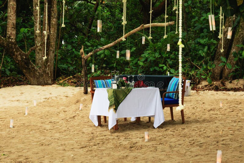 Dining Table Set Up for Romantic Date on Sandy Beach. Stock Photo ...