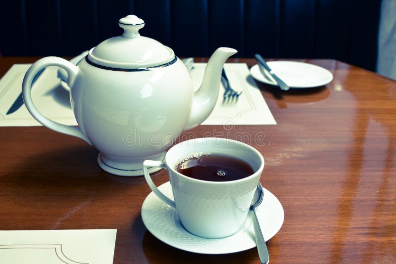 Dining Table with Tea and Teapot Stock Photo - Image of sofa, tableware ...