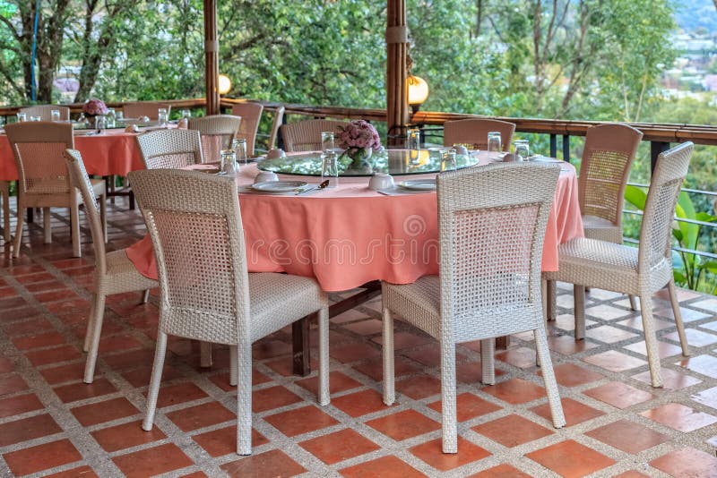 Dining Table on terrace stock image. Image of chairs - 66502131