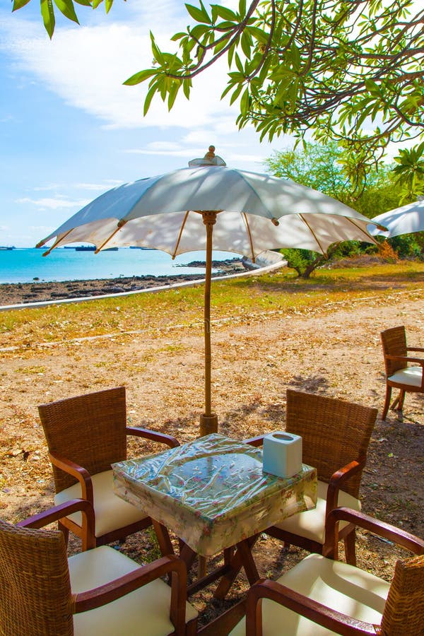 Dining Table and umbrella. stock image. Image of park - 34619795