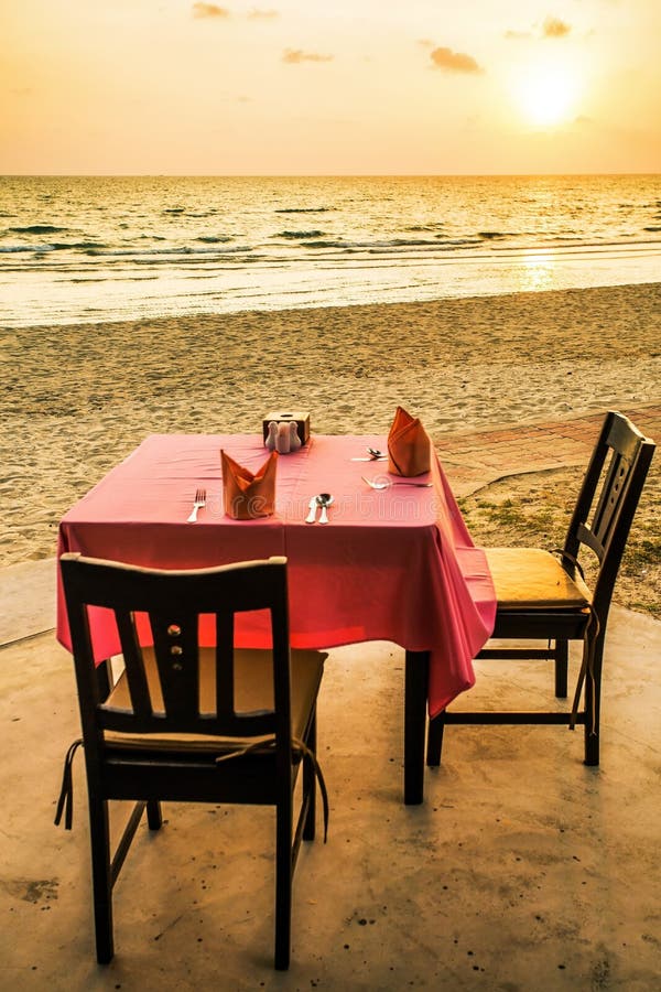 Dining Tableon White Sand Beach with Sunset View Stock Photo - Image of ...