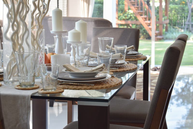 Dining Wooden Table and Comfortable Chairs in Modern Home Stock Photo ...