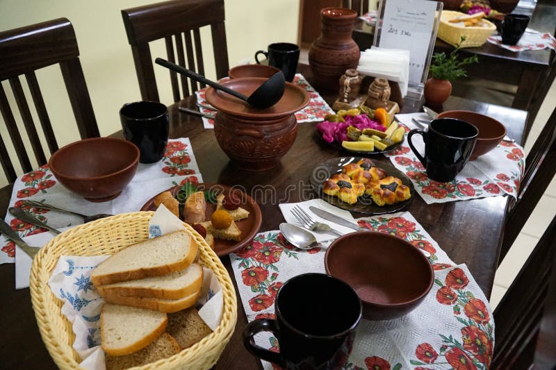 Dinner in Clay Dishes of Traditional Ukrainian Dishes. Stock Photo ...