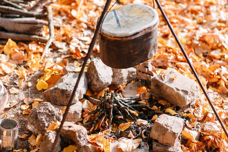 Dinner Cooks in a Large Pot Over an Open Fire. Autumn Forest Stock ...