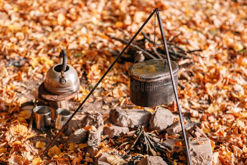 Dinner Cooks in a Large Pot Over an Open Fire. Autumn Forest Stock ...