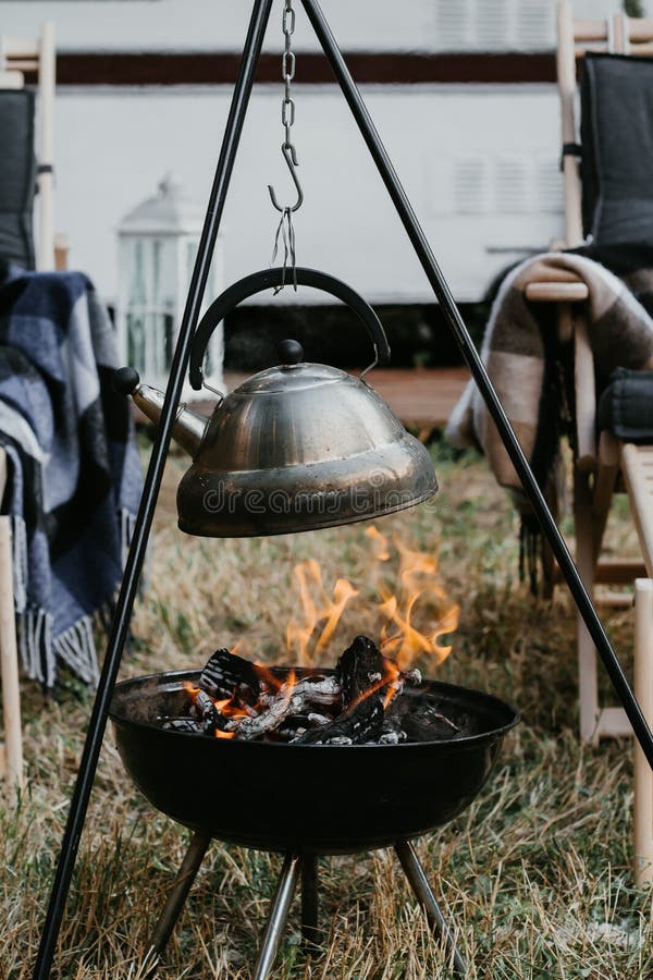Dinner Cooks in a Large Pot Over an Open Fire Stock Photo - Image of ...