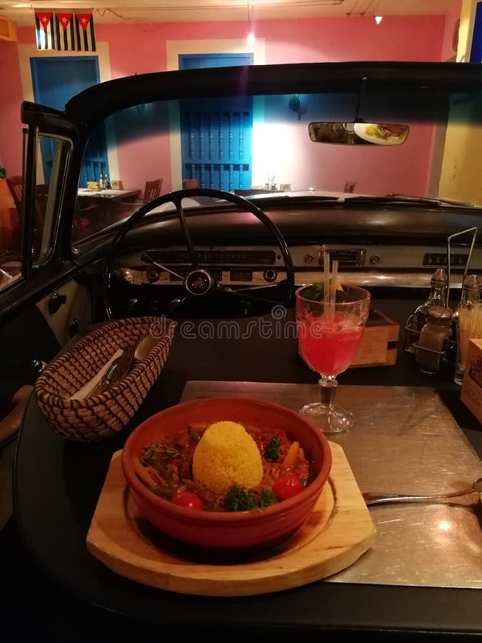 Dinner into a retro car stock image. Image of drink - 272772257