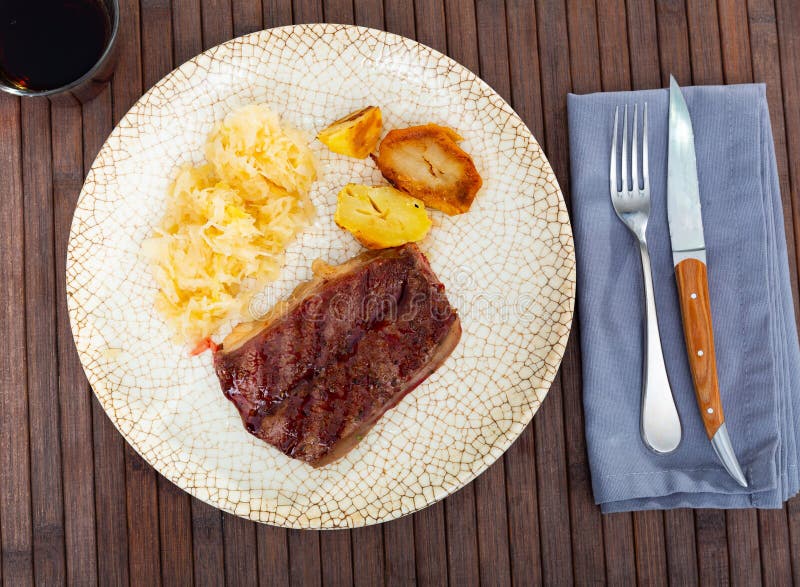 Dinner - Dish with Beef Chop, Boiled Potatoes and Sauerkraut Closeup ...