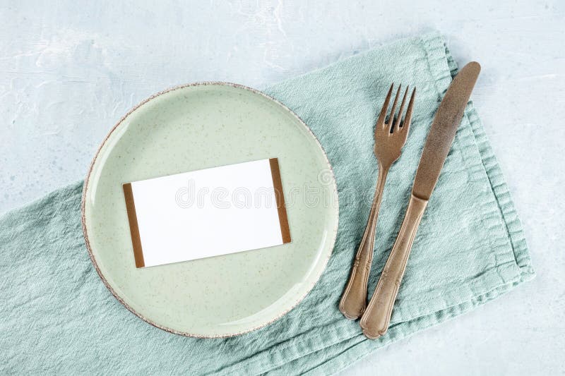 Dinner Invitation. a Card on a Green Plate, with Silverware Stock Image ...