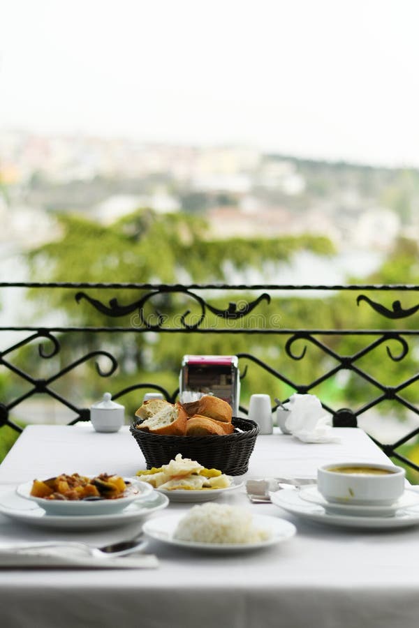 Dinner Outside, Food in Plates on a Balcony Table Stock Photo - Image ...