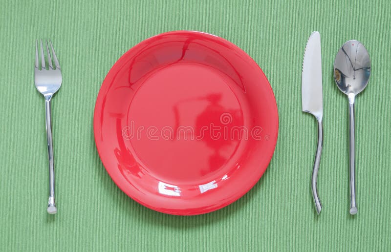 Dinner Place Setting a Red Plate with Silver Fork Stock Photo - Image ...