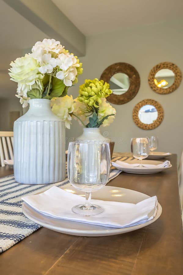 Dinner Setting Inside the Dining Room of a Home with Mirrors and Wall ...