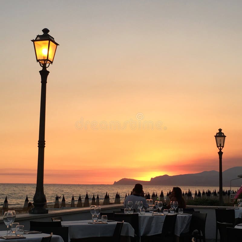 Dinner at sunset editorial stock image. Image of sunset - 98627679
