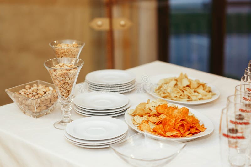 Dinner Table with Appetizers - Peanuts and Chips Stock Image - Image of ...