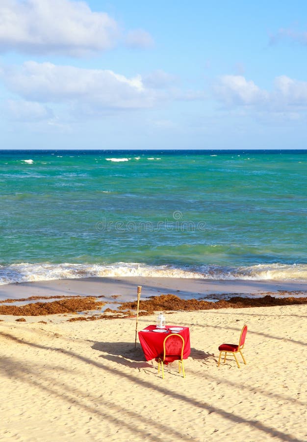Dinner table on the beach stock image. Image of blue - 49053747