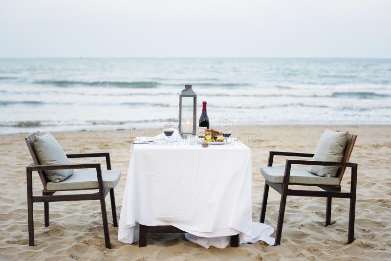 Dinner table by the sea stock photo. Image of leisure - 121035602