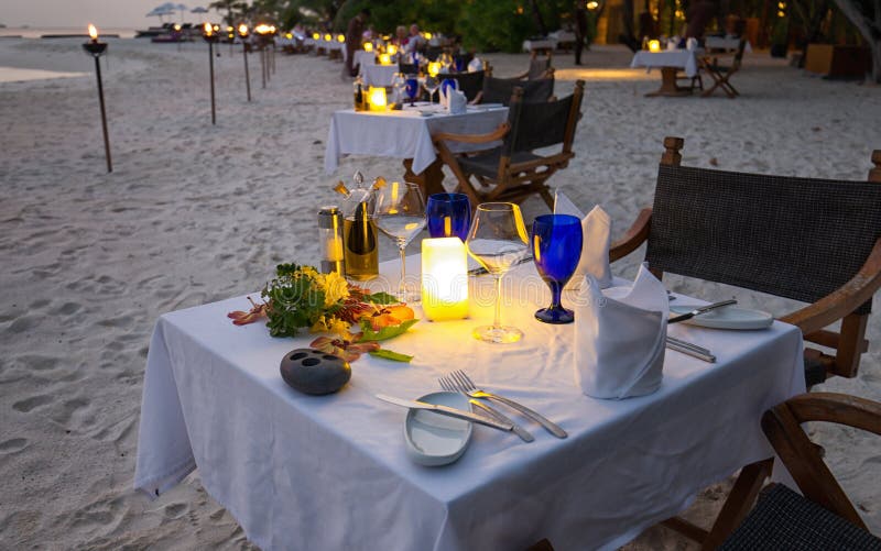Dinner Table Setting on the Beach Stock Image - Image of knife, blue ...