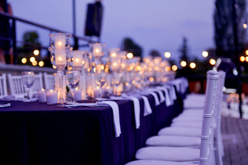 Dinner Table with Candles at a Wedding by Night Stock Photo - Image of ...
