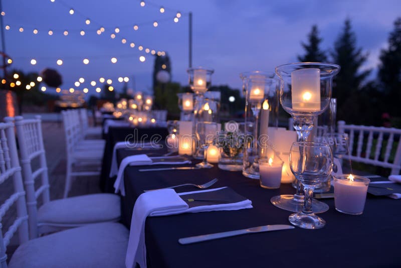 Dinner Table with Candles at a Wedding by Night Stock Photo - Image of ...
