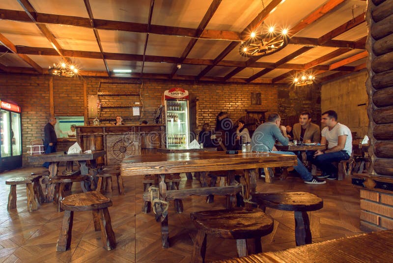 Dinner of Visitors of the Traditional Cafe with Wooden Furniture ...