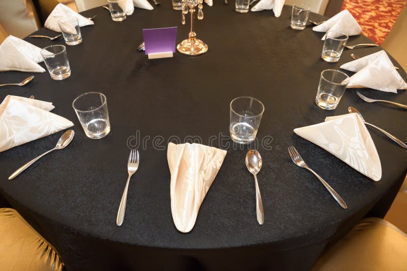 A Dinning Table at a Restaurant Set Ready for Serving Ten Guests Stock ...