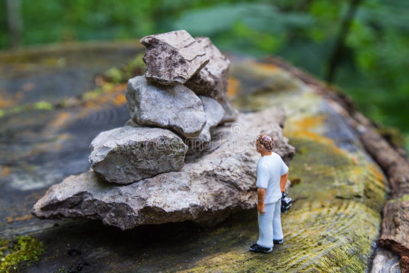 Diorama of man and rocks stock image. Image of large - 27137079