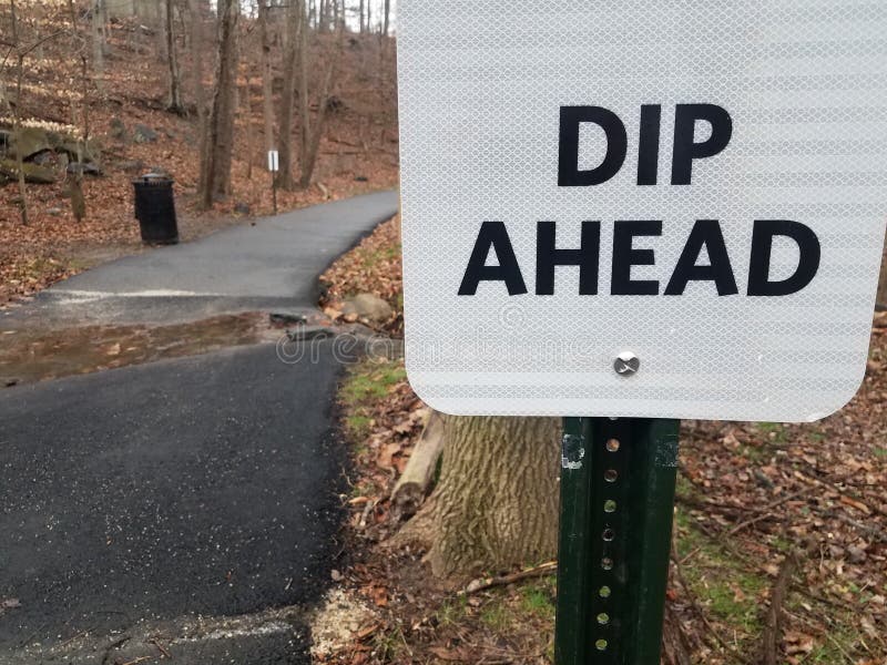 Dip Ahead Sign on Path or Trail with Water Stock Image - Image of ...