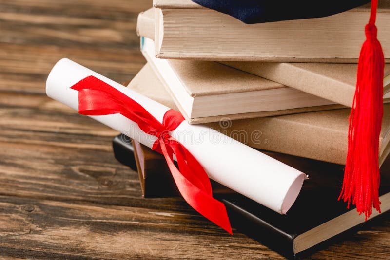 Graduation Cap on Stack of Open Books Stock Image - Image of education ...