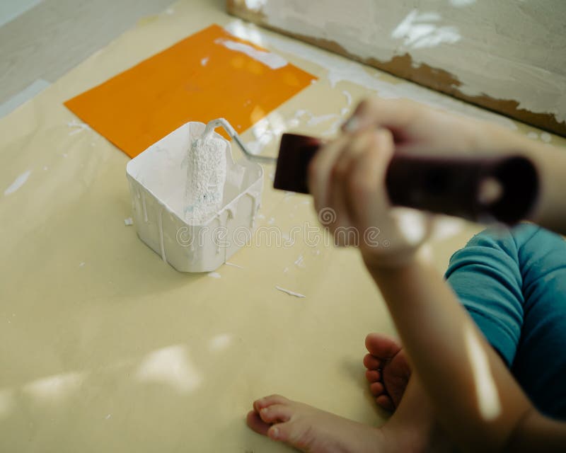 Dipping Roller Paint into the Paint Container Stock Photo - Image of ...