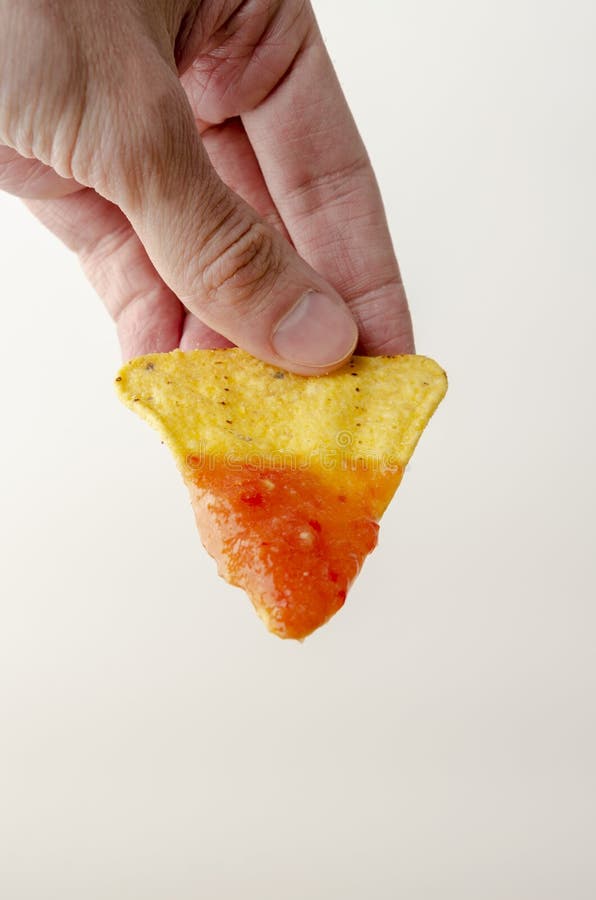 Dipping Tortilla Chips with Salsa Sauce in Dish on Isolated White Background Stock Photo - Image ...